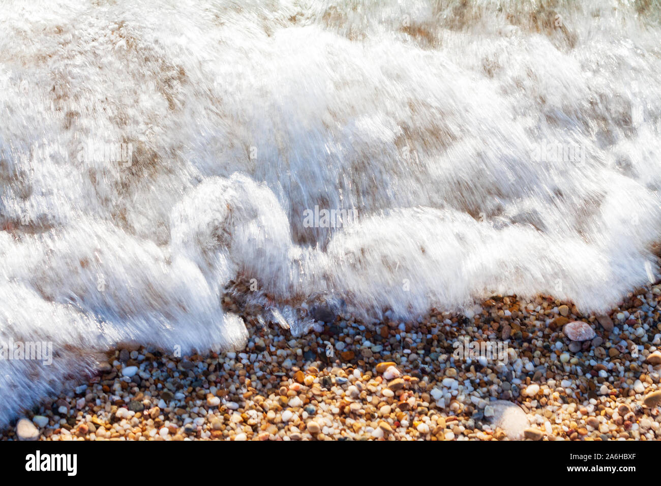 sea pebbles colored granite on the beach background stones. The shore ...