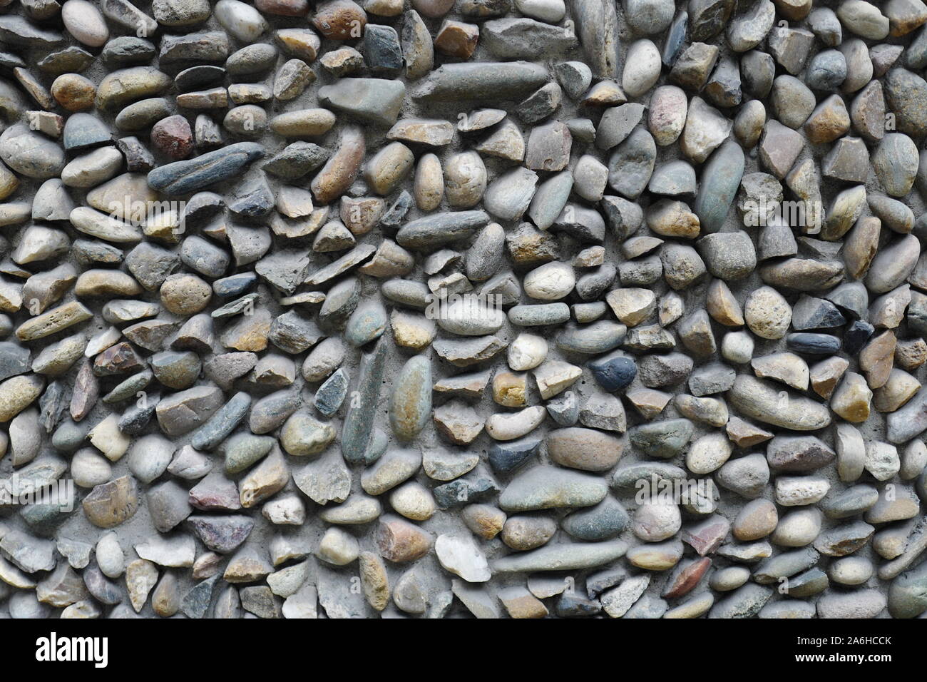 wall of tightly packed round gray stones, full-frame detail Stock Photo ...