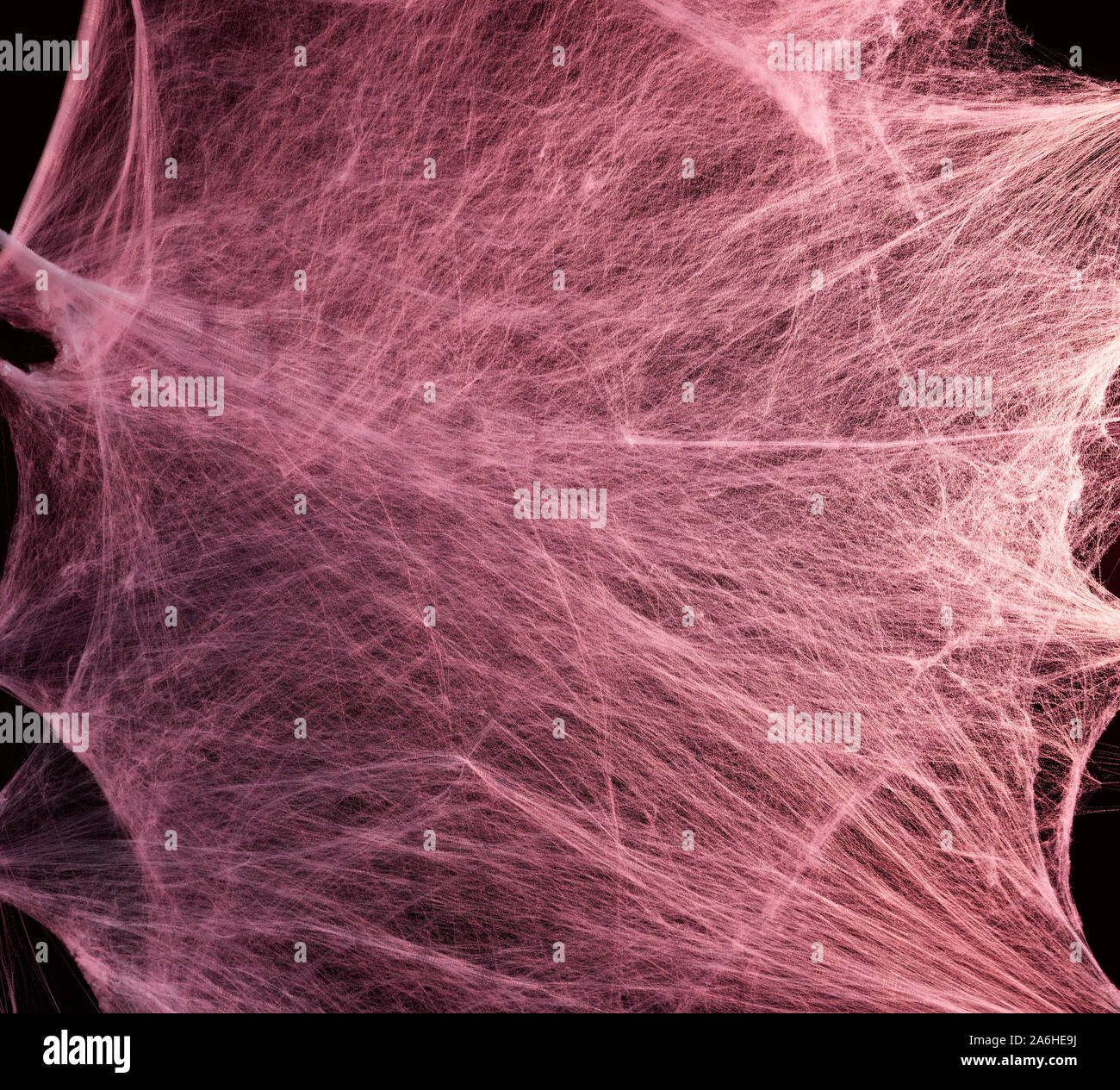 stretched white web with red backlight, background for the holiday ...