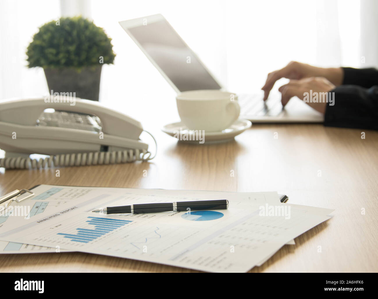 Pen on the desk of a working woman Stock Photo - Alamy