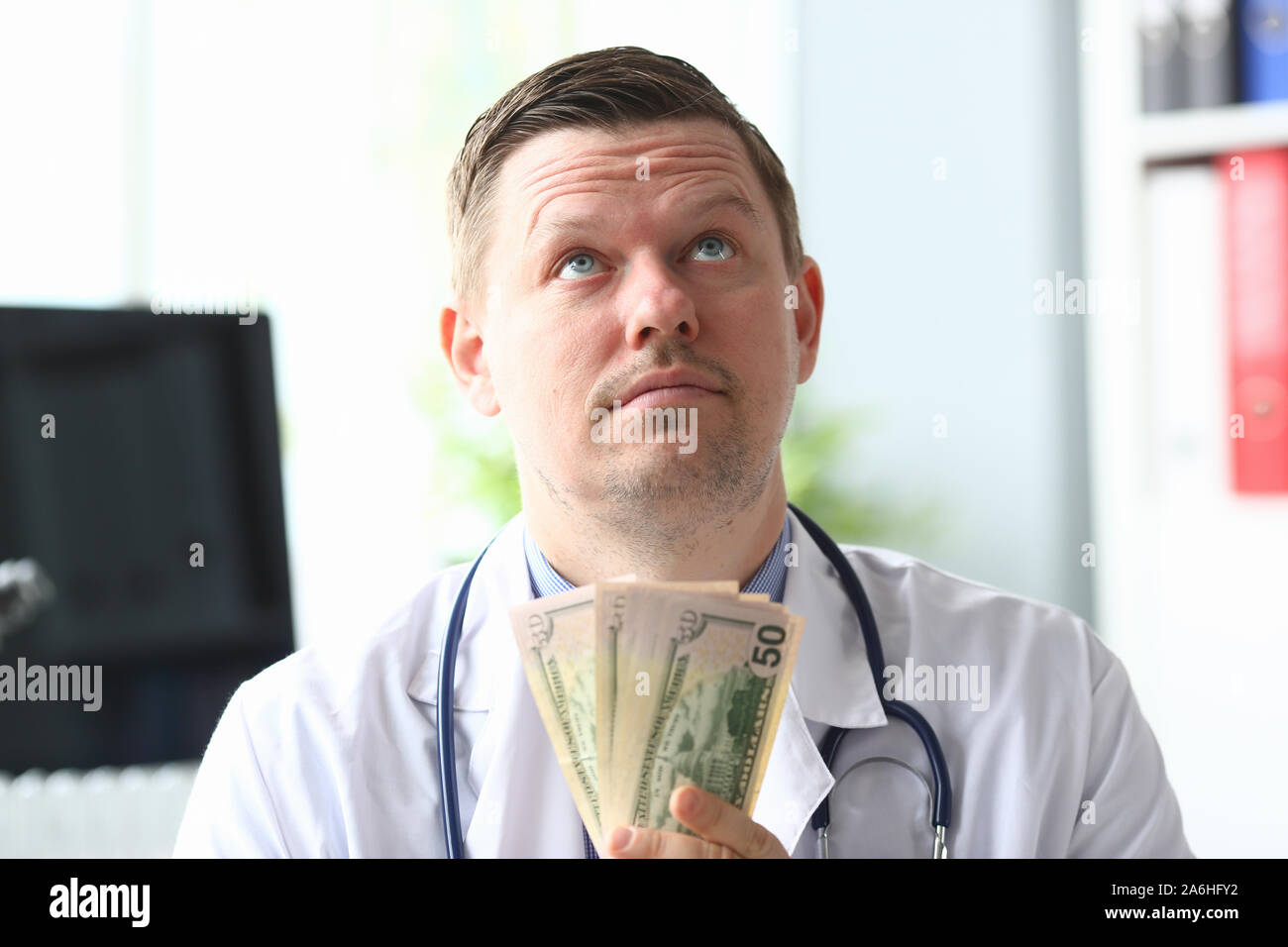 Flattered male doctor Stock Photo - Alamy