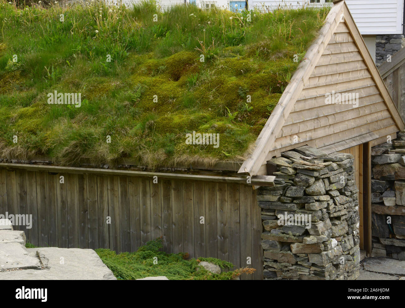 vintage hut with grass on the roof in the small city of Norway, rooftop ...