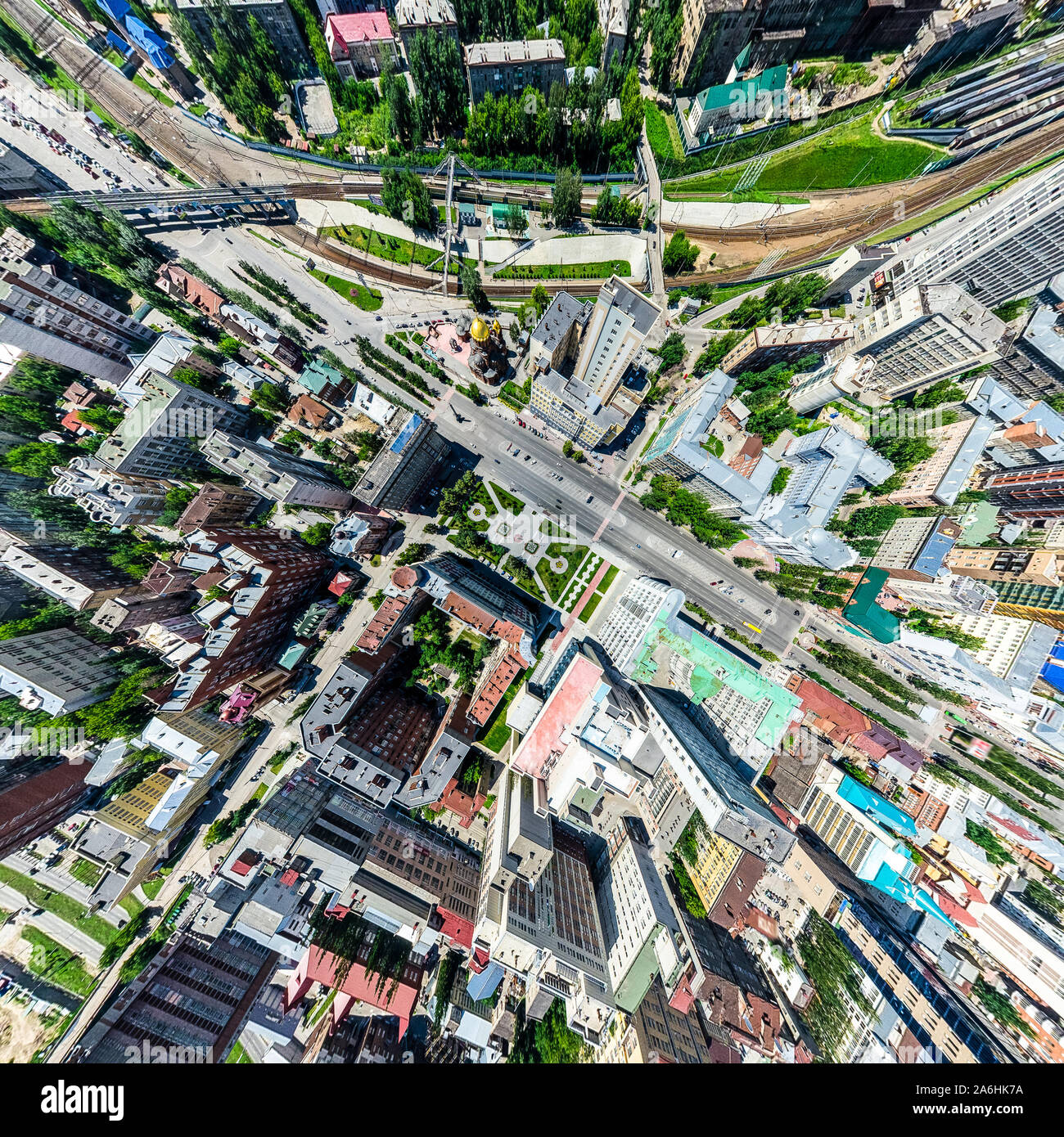 Aerial city view with crossroads and roads, houses, buildings, parks ...