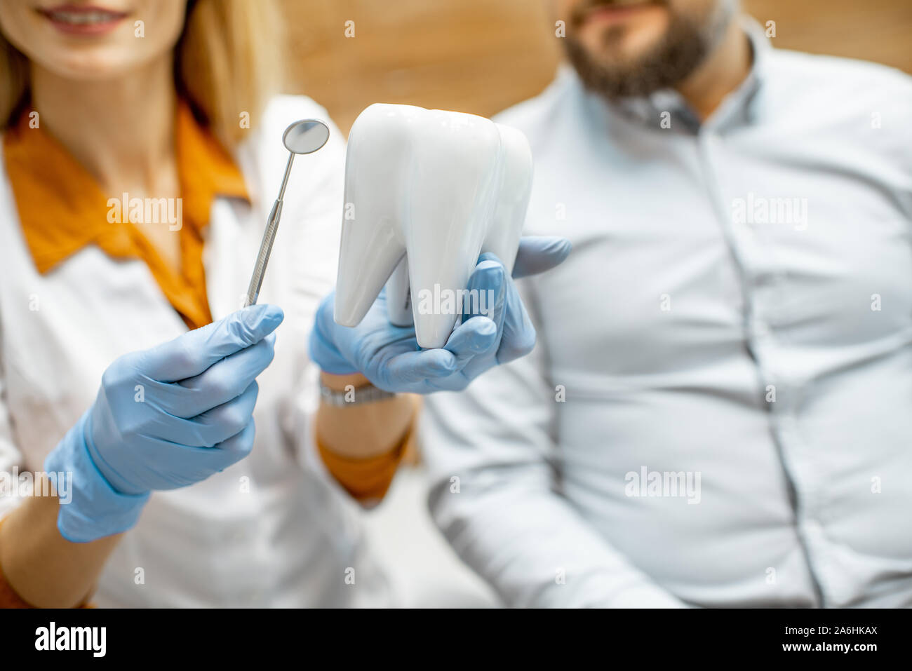 Dentist with patient during a medical consultation, doctor holding ...