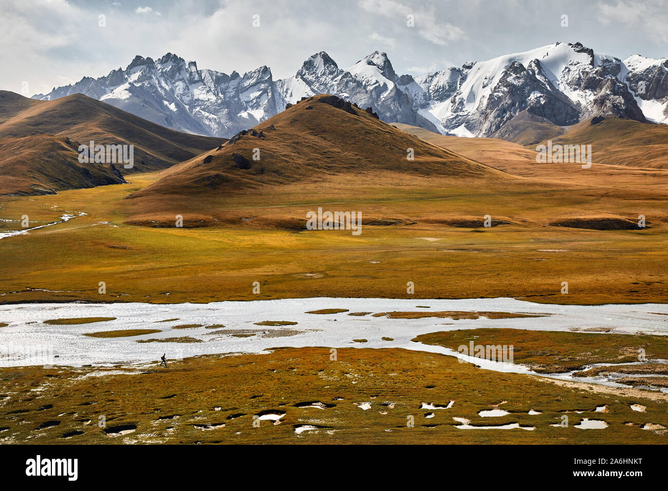 Aerial view of beautiful mountain valley with small tourist and river ...