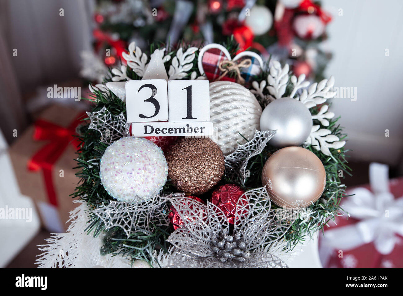 Wooden calendar with on the background of a Christmas tree with a date ...