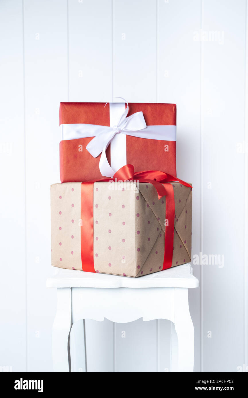 Creative, bright photo minimalism, one-on-one gift boxes on a white ...