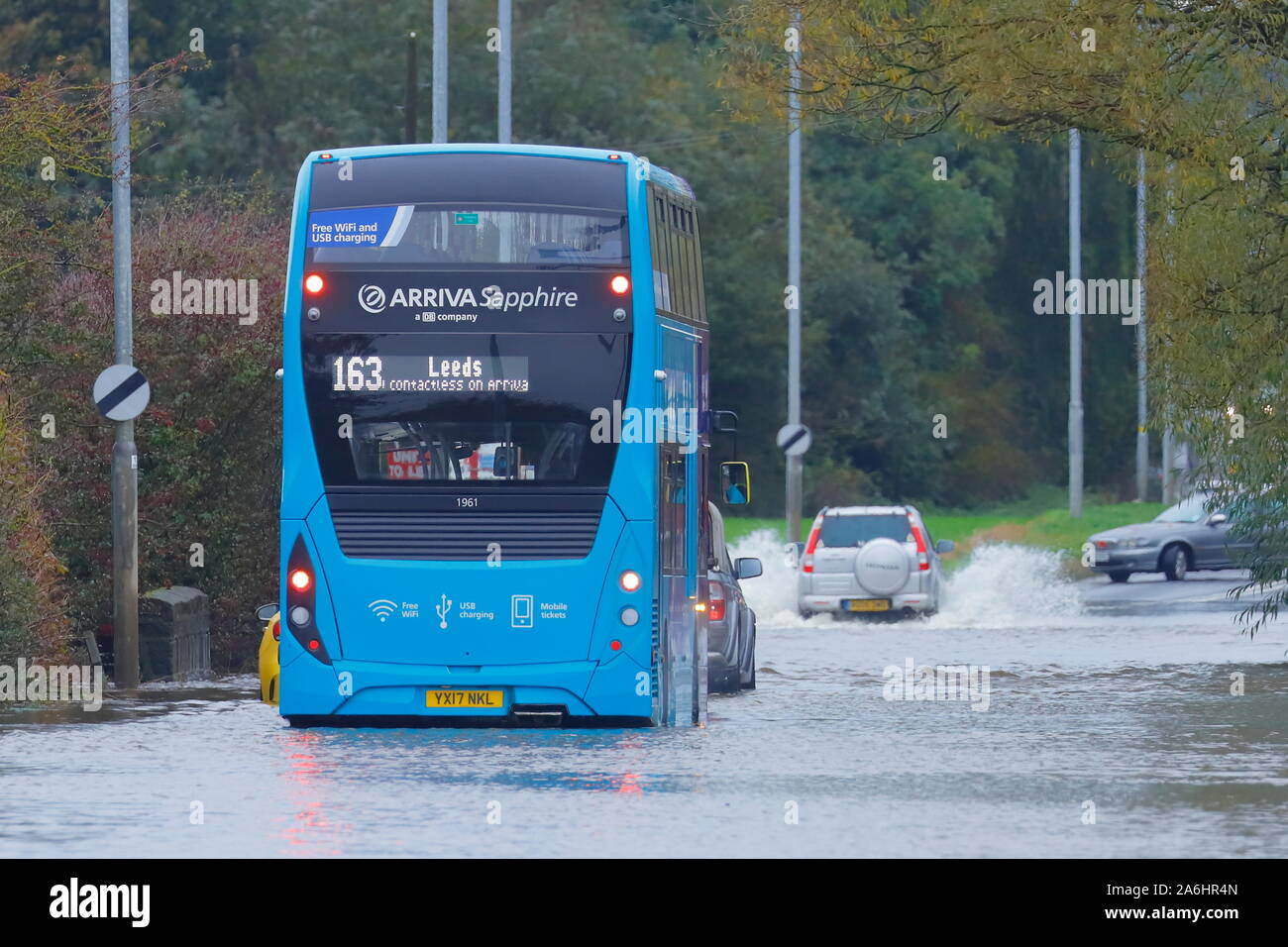 A bus becomes stranded after driving through floods on Barnsdale Road ...