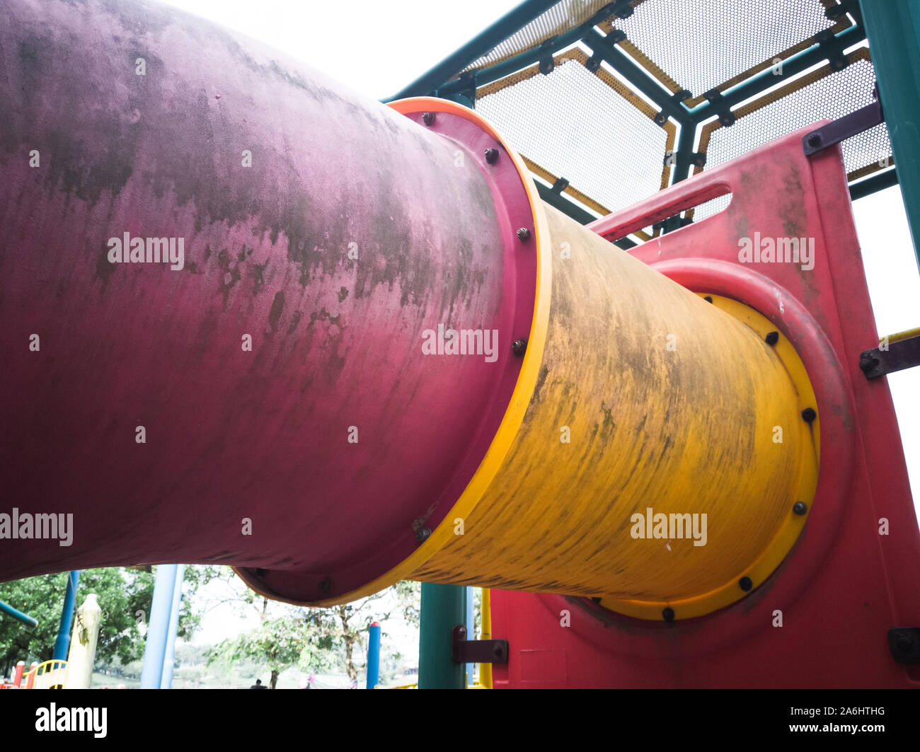 Old dirty playground in a tropical country Stock Photo - Alamy