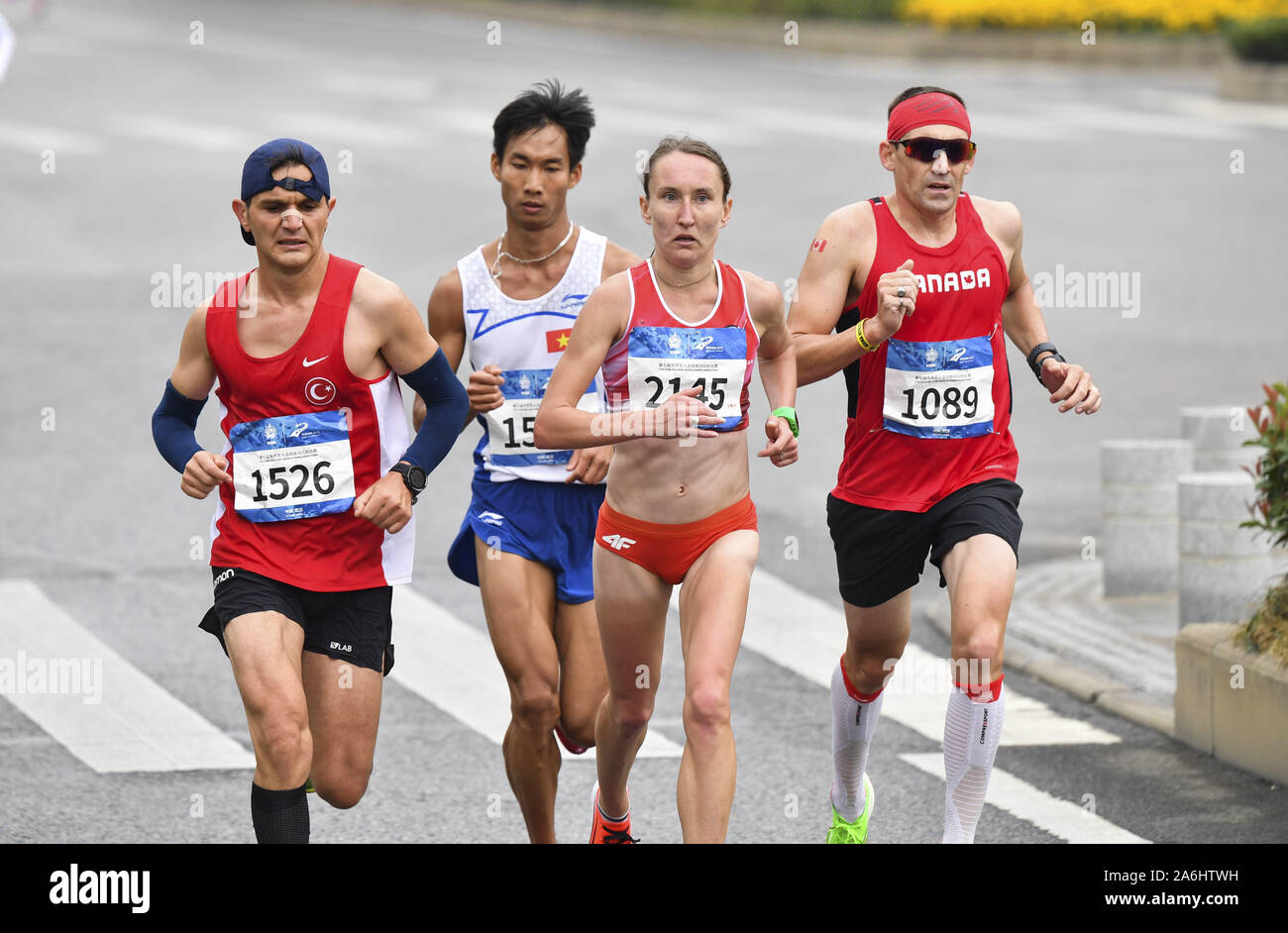 Wuhan, China. 27th Oct, 2019. Athletes compete during the marathon of ...