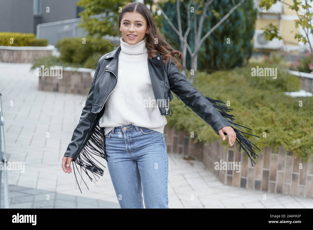 Beautiful young lady twirling during her stroll in the garden Stock ...