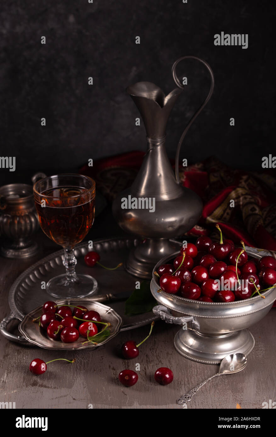 Vintage still life with cherry and pewter Stock Photo - Alamy