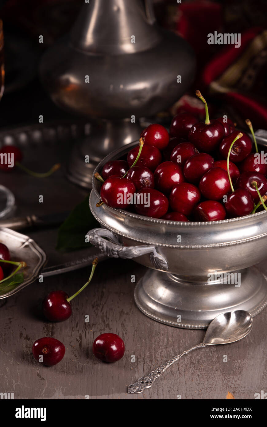 Vintage still life with cherry and pewter Stock Photo - Alamy