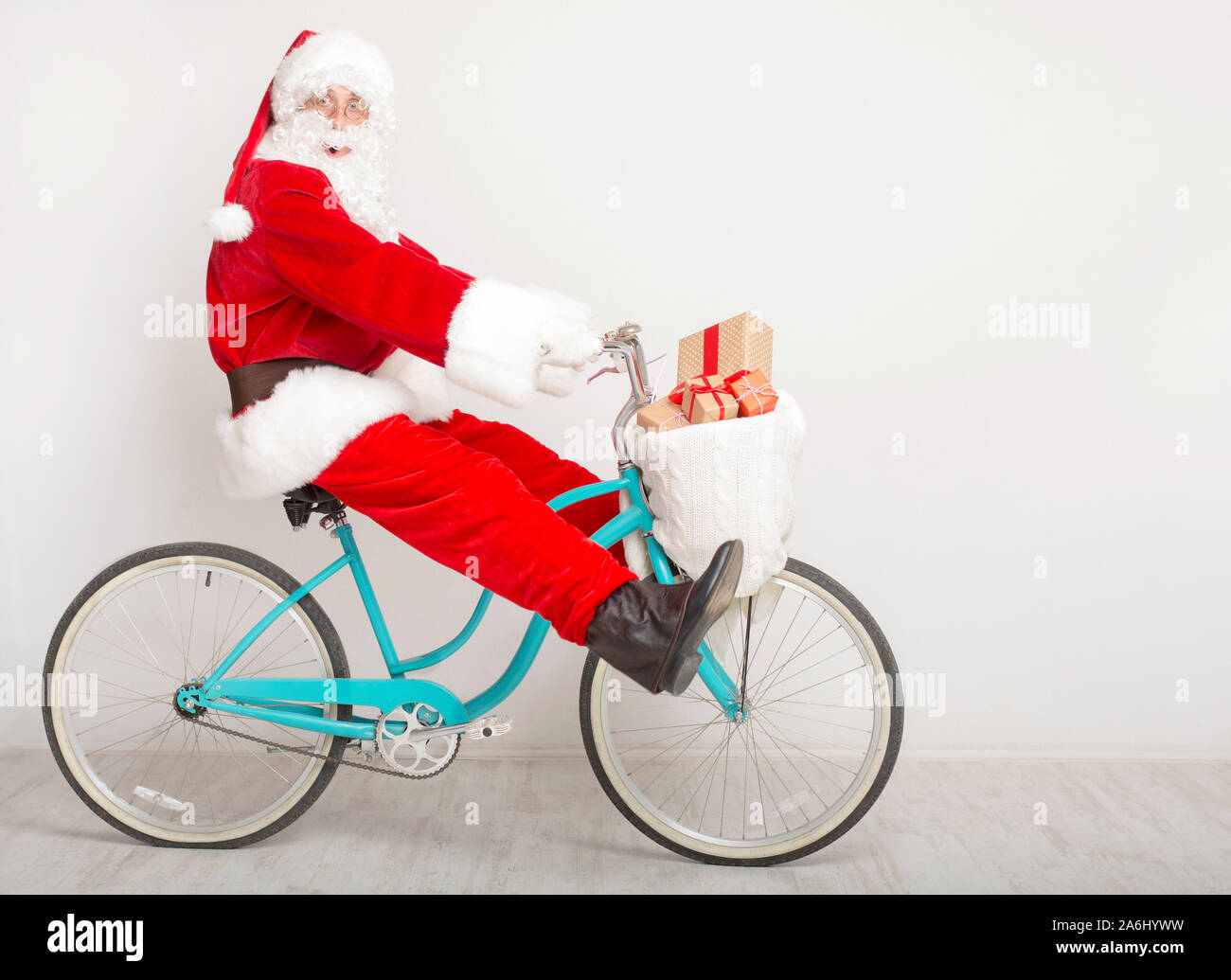 Santa on bike hi-res stock photography and images - Alamy