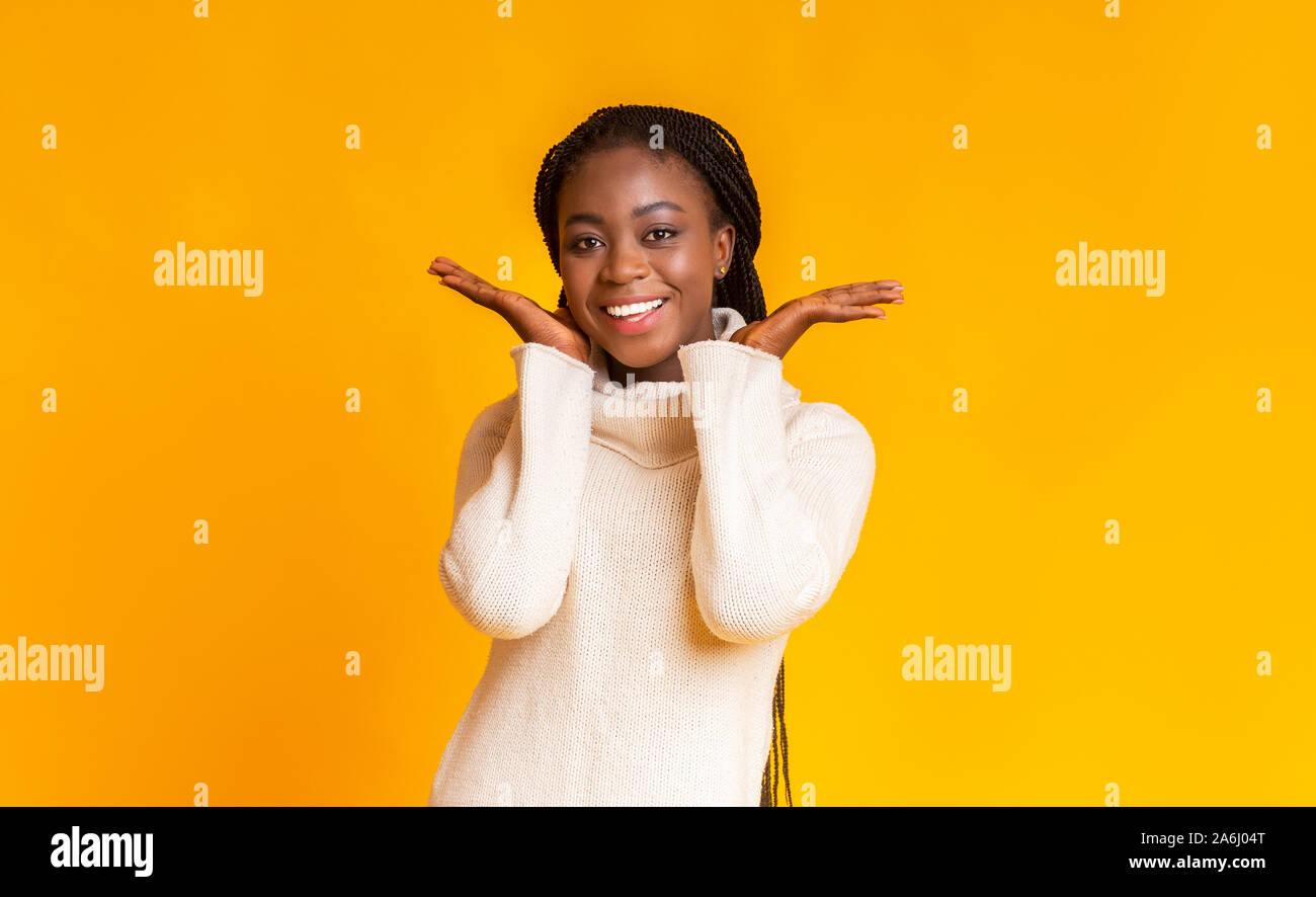 Portrait of joyful black girl touching her cheeks with hands Stock ...