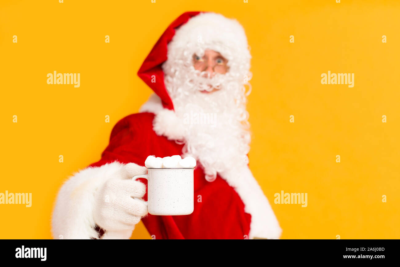 Blurred Santa Claus drinking hot cocoa with marshmallows Stock Photo ...