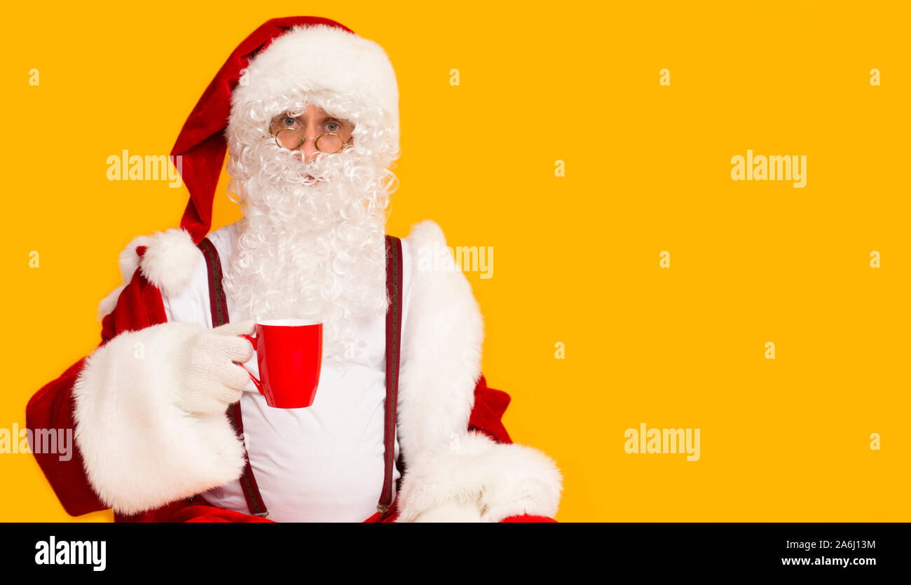 Santa claus holding red cup hi-res stock photography and images - Alamy