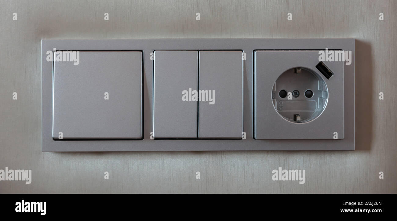 Electric socket and light switch panel, gray silver color, Close up ...