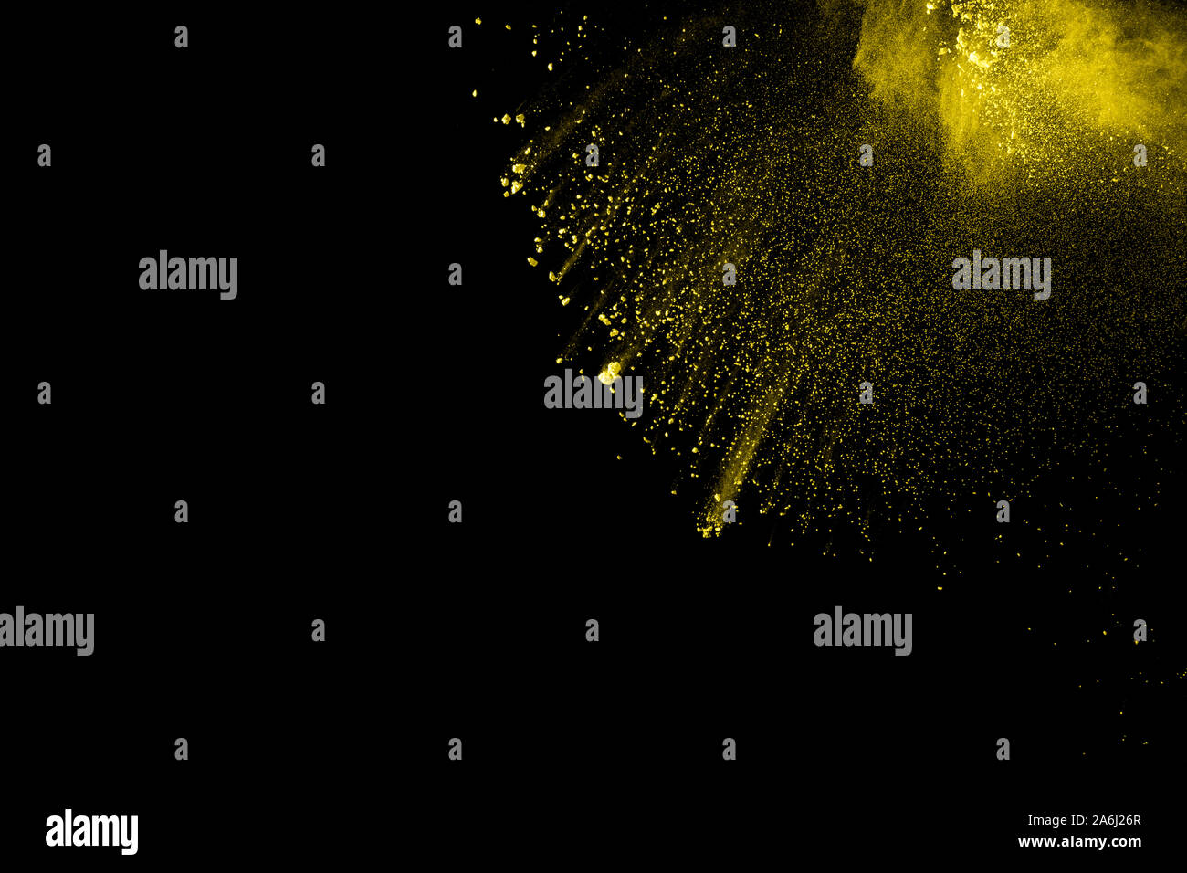 Yellow dust particles explosion on black background.Yellow powder ...