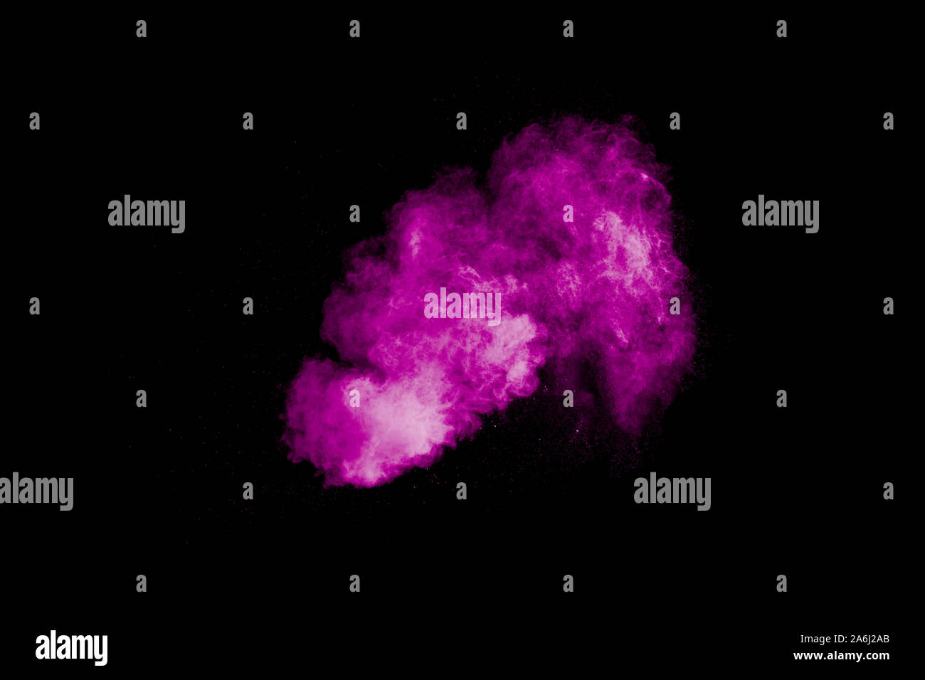 Purple orange color powder explosion cloud on black background.Closeup ...