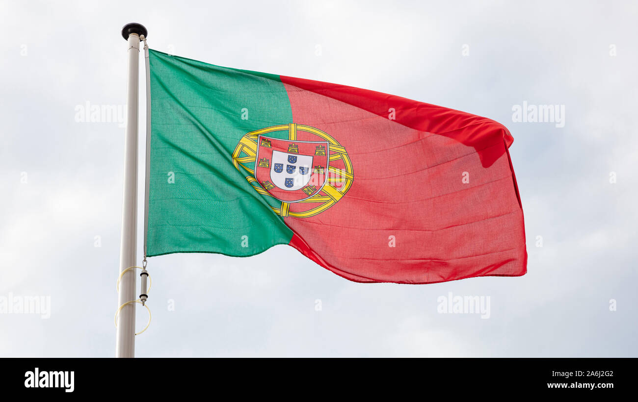 Portugal flag. Portuguese national sign and symbol waving on a flagpole ...