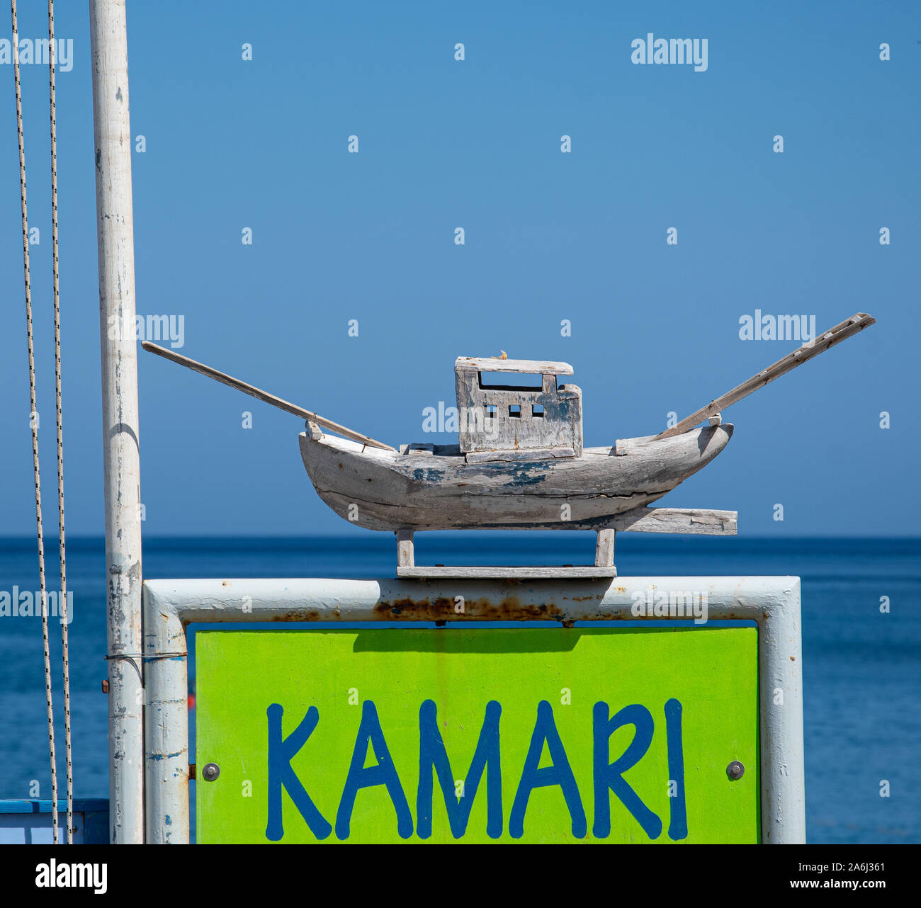 Kamari, Greece - July 14 2019: A small replica of a fishing boat used ...