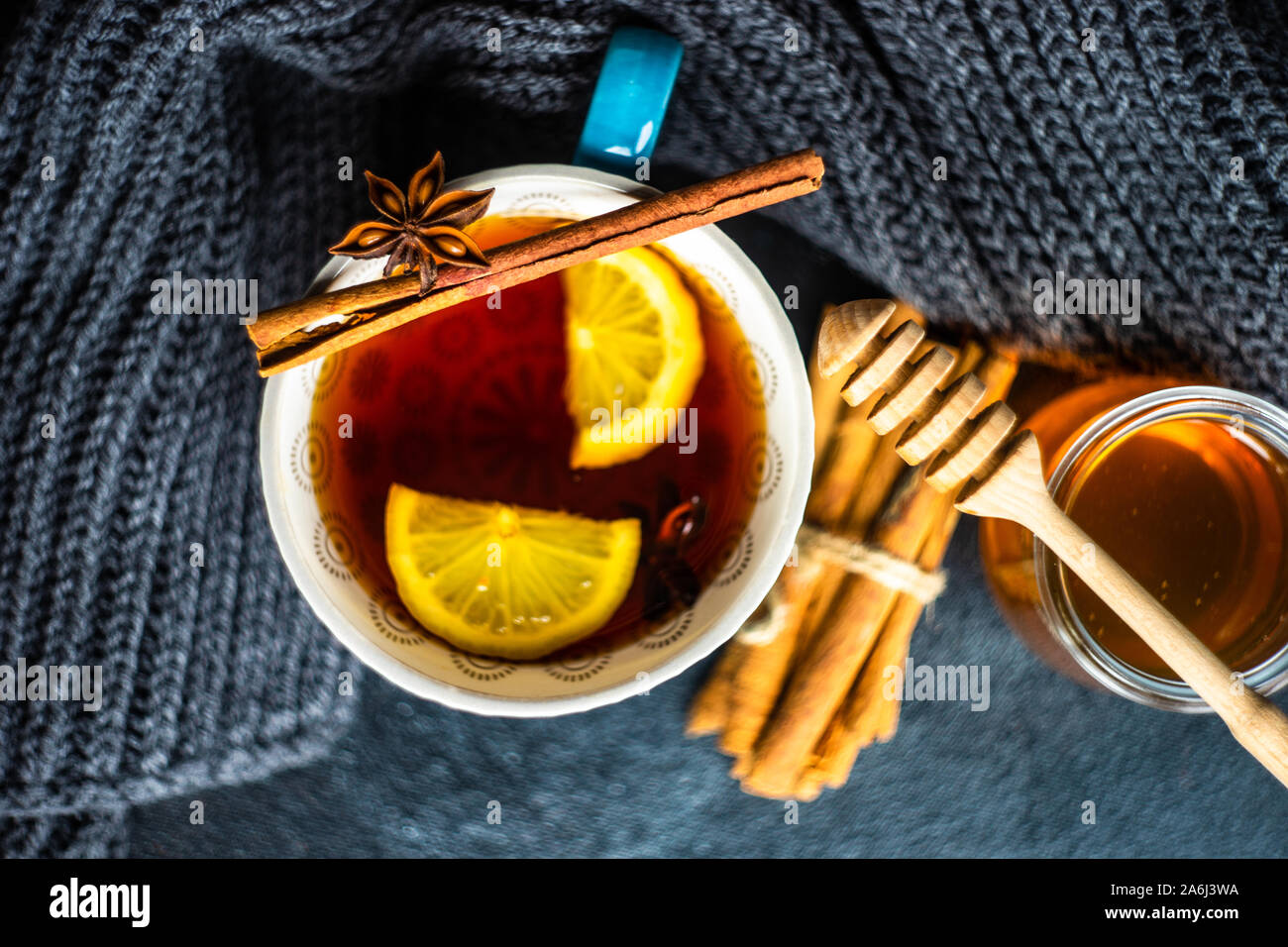 Mulled tea with lemon and spices on stone table with copy space Stock ...