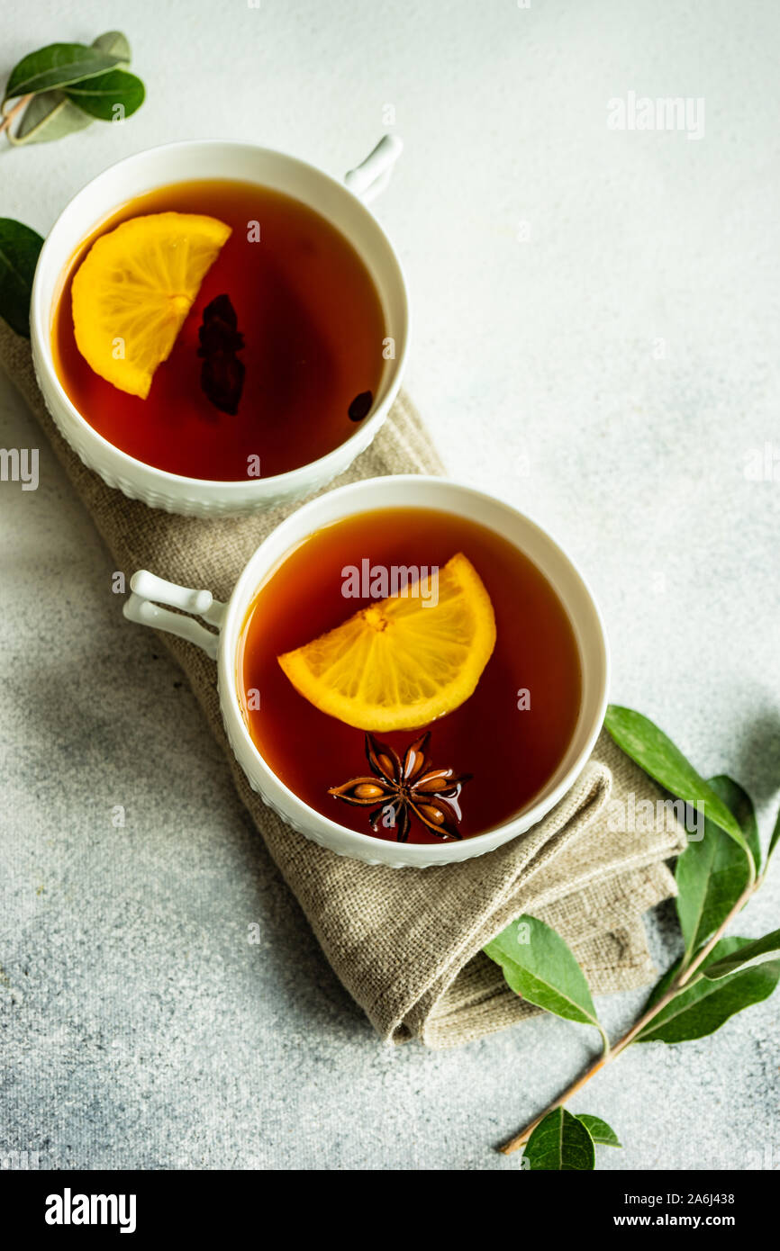 Mulled tea with lemon and spices on stone table with copy space Stock ...