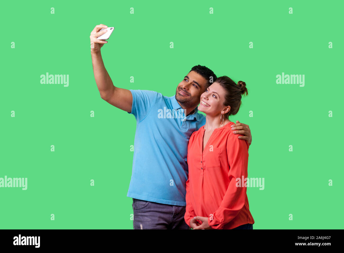 Couple doing selfie! Portrait of positive young man and woman in casual ...