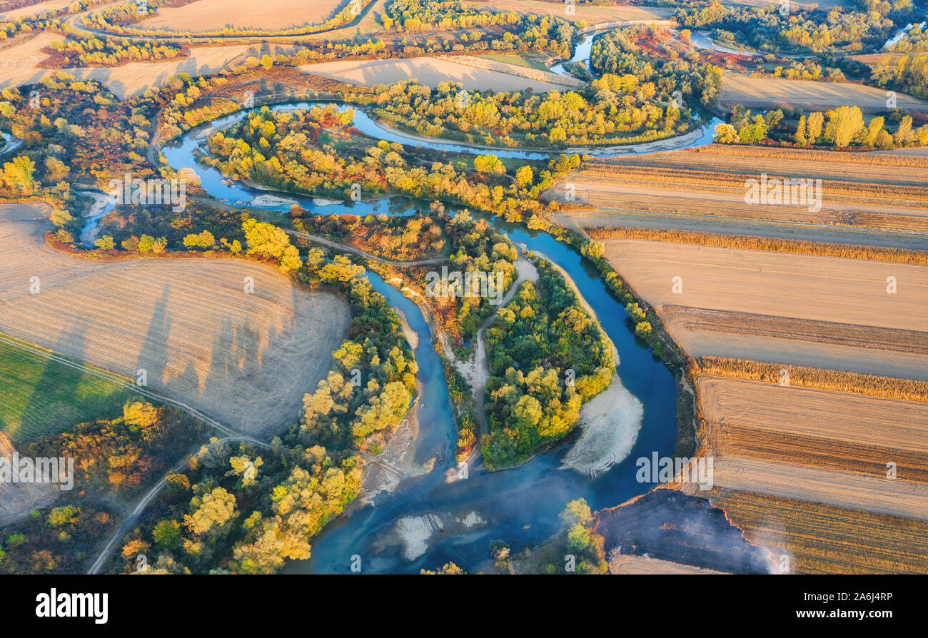 Aerial view of river shape during autumn Stock Photo - Alamy