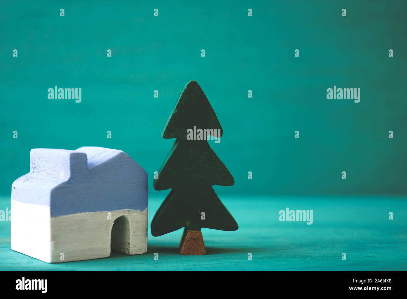 House and tree on green background Stock Photo - Alamy