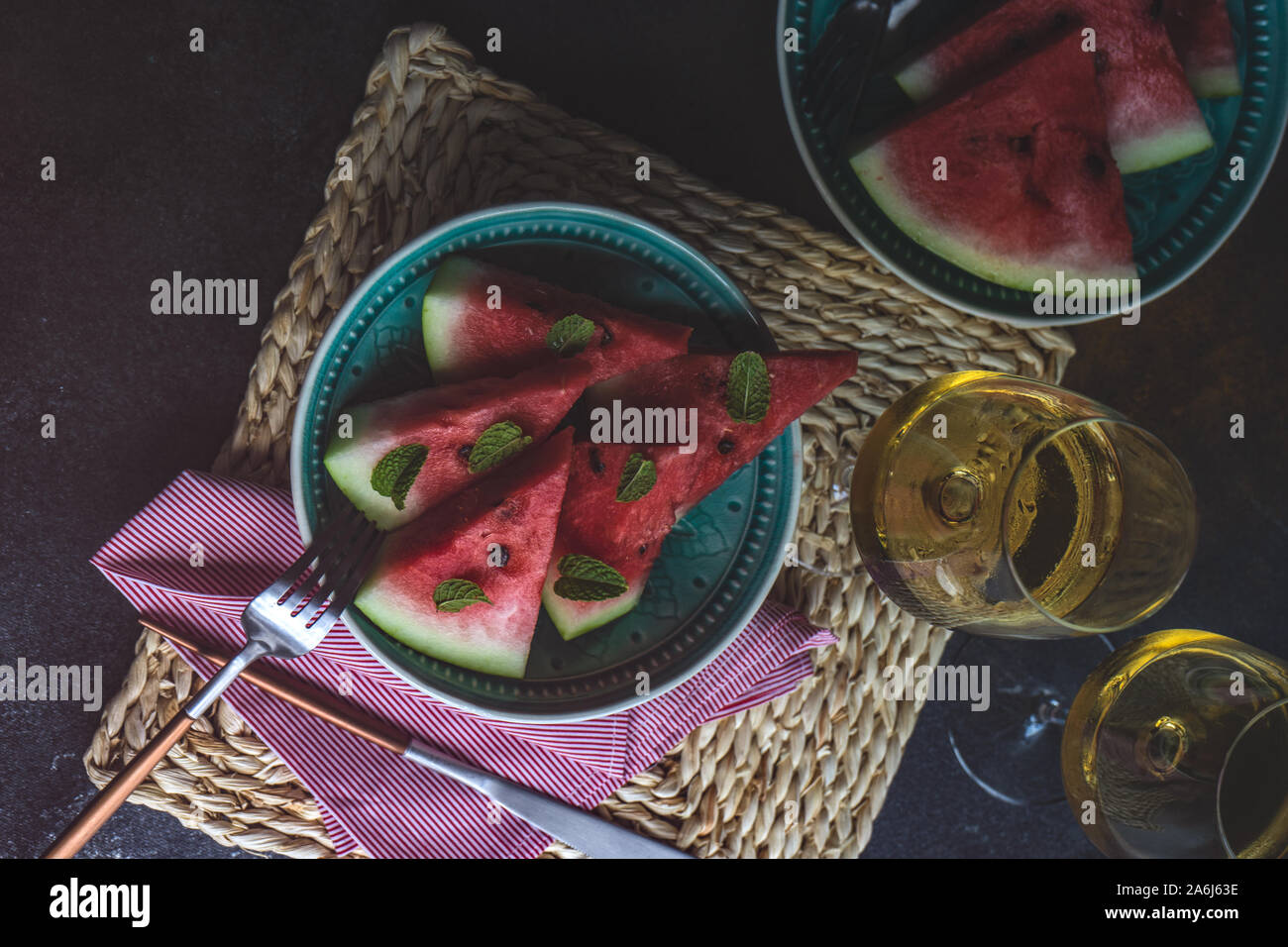 Organic watermelon slice on a plate served on stone background with ...