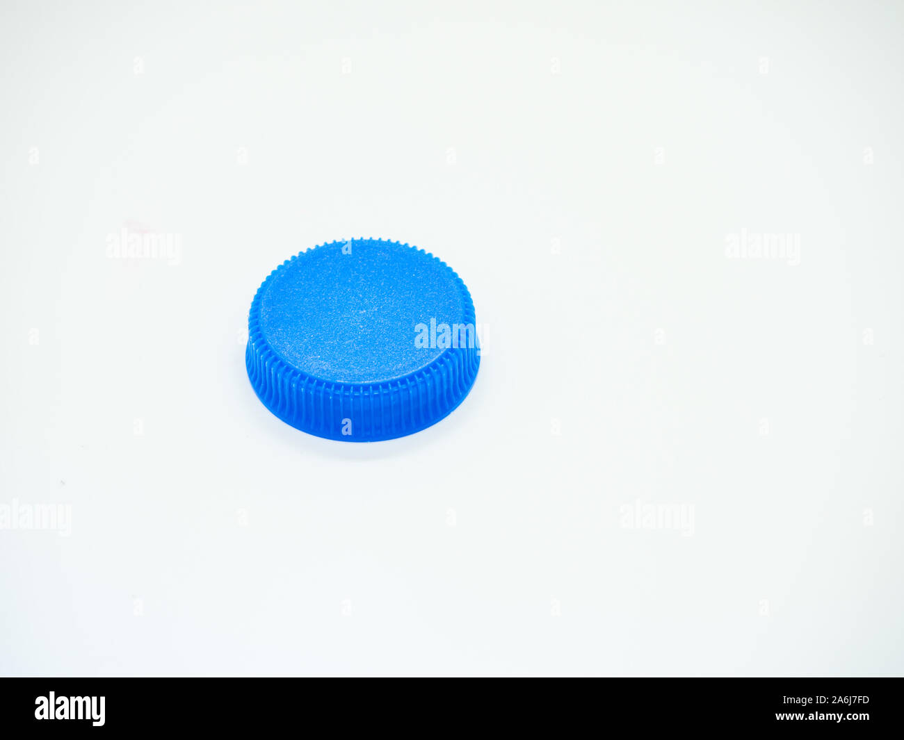 Blue plastic stopper on white background Stock Photo - Alamy