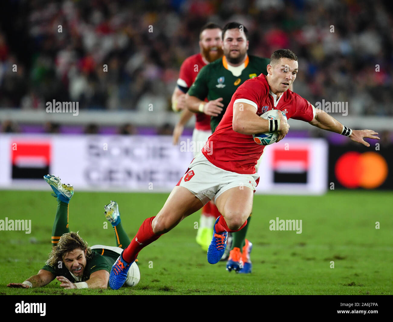 Wales' George North evades the tackle of South Africa's Faf de Klerk ...