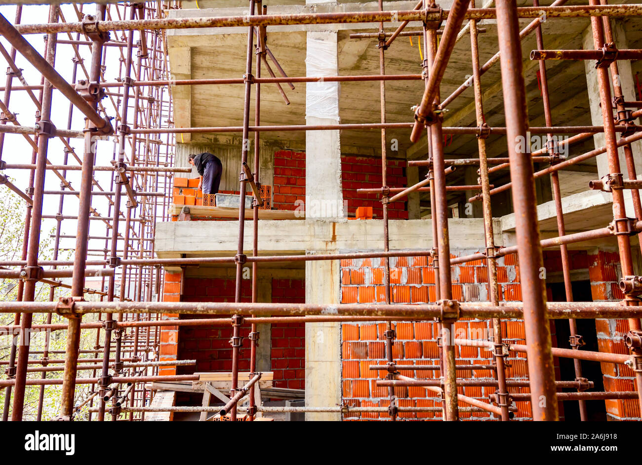 Scaffold is placed against edifice, building under construction Stock ...