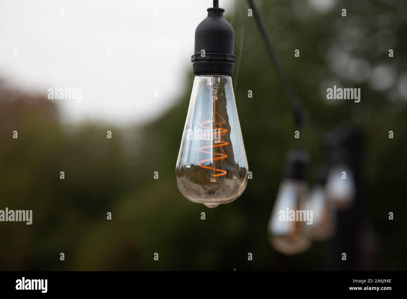 Outdoor lightbulb string Stock Photo - Alamy