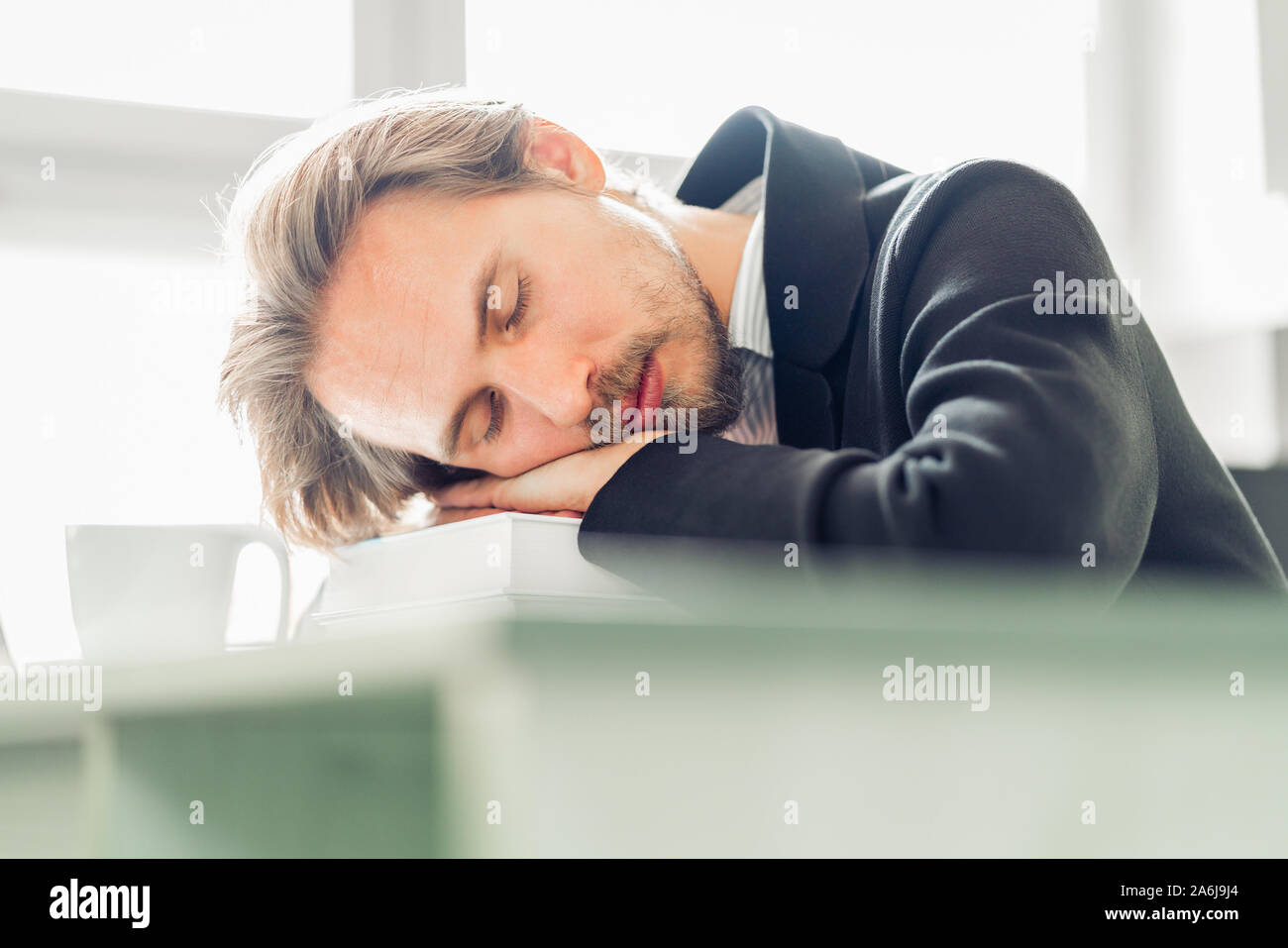 Sleepy man working on computer hi-res stock photography and images - Alamy