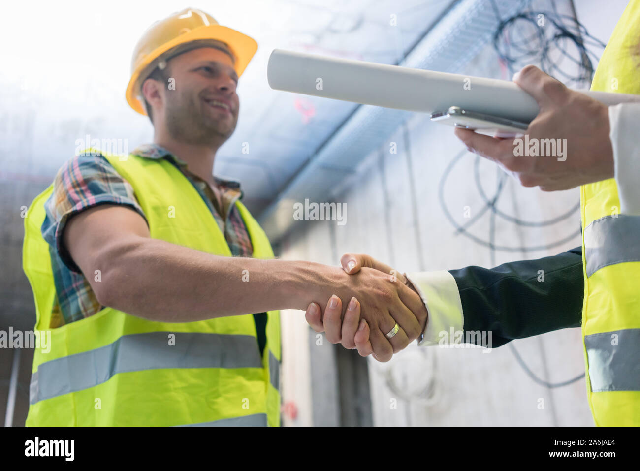 Handshake on the construction site Stock Photo - Alamy