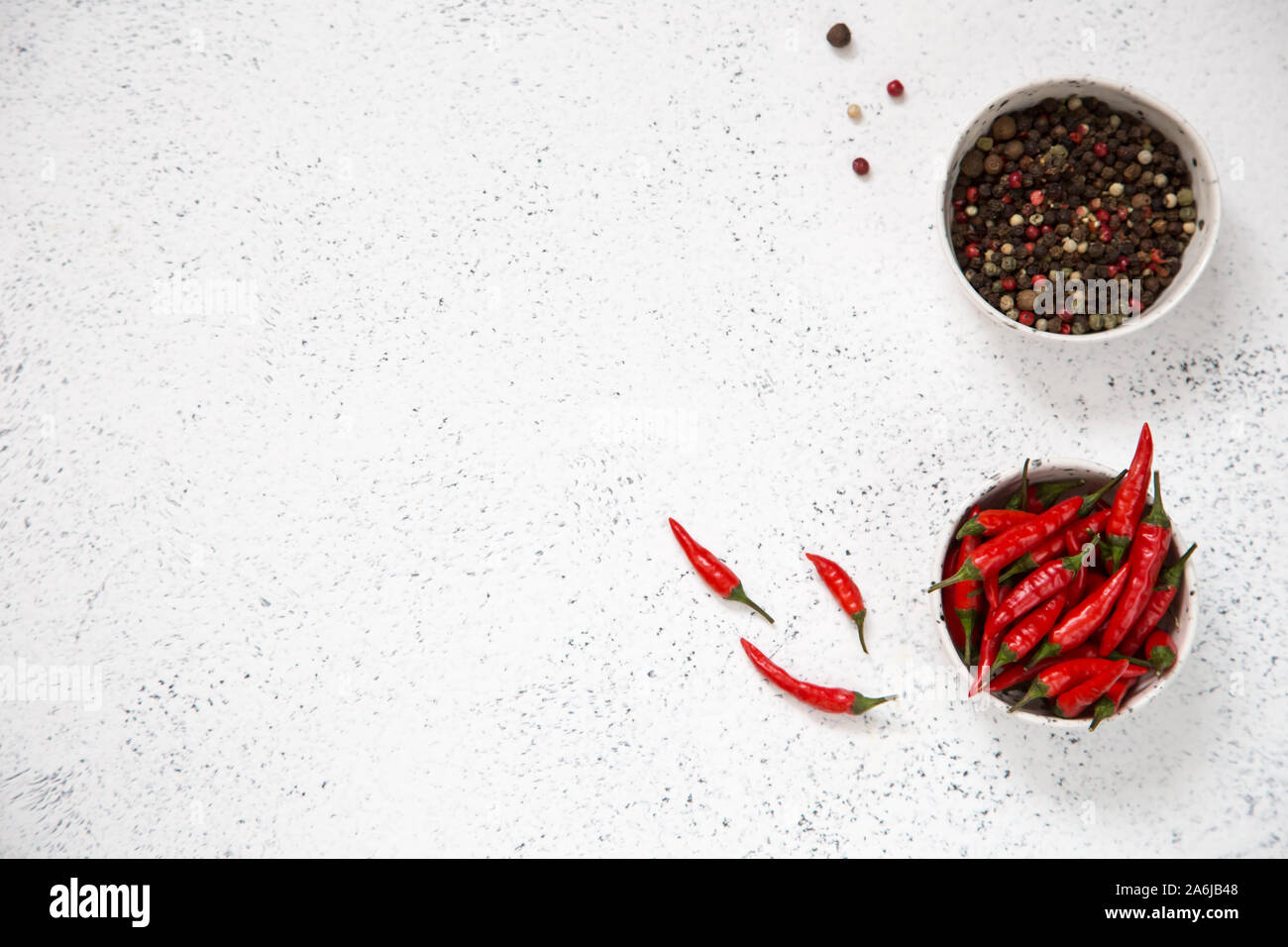 Red hot chilli peppers. background with red chili peppers on light ...