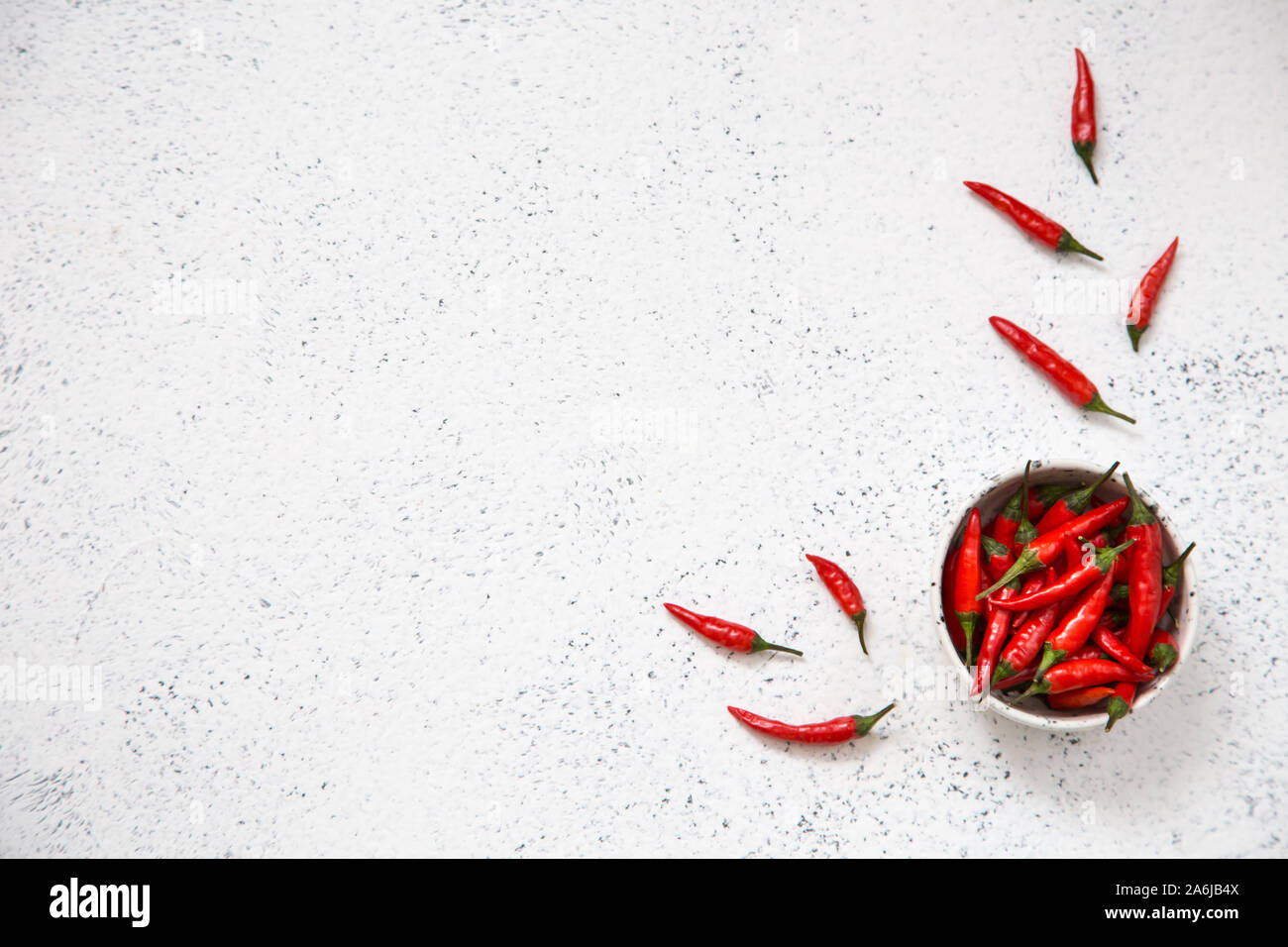 Red hot chilli peppers. background with red chili peppers on light ...