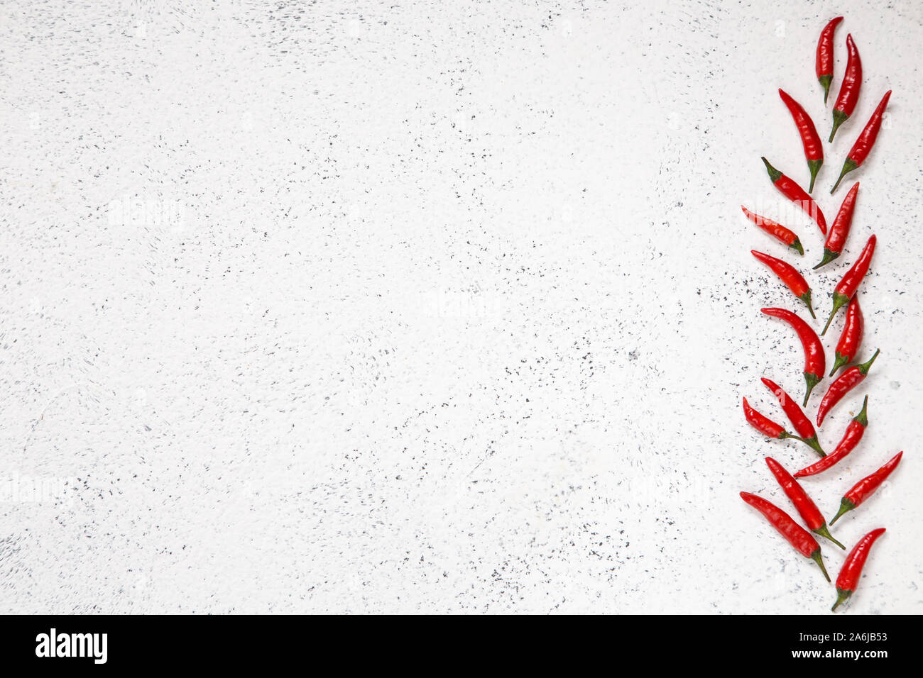 Red hot chilli peppers. background with red chili peppers on light ...