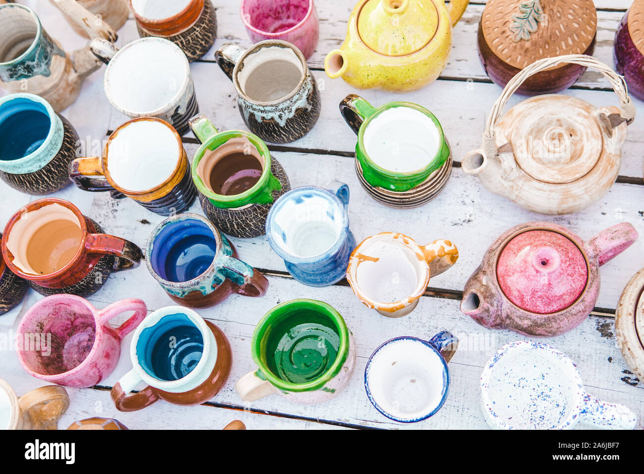 lots of different dishes standing on the table eating and drinking ...