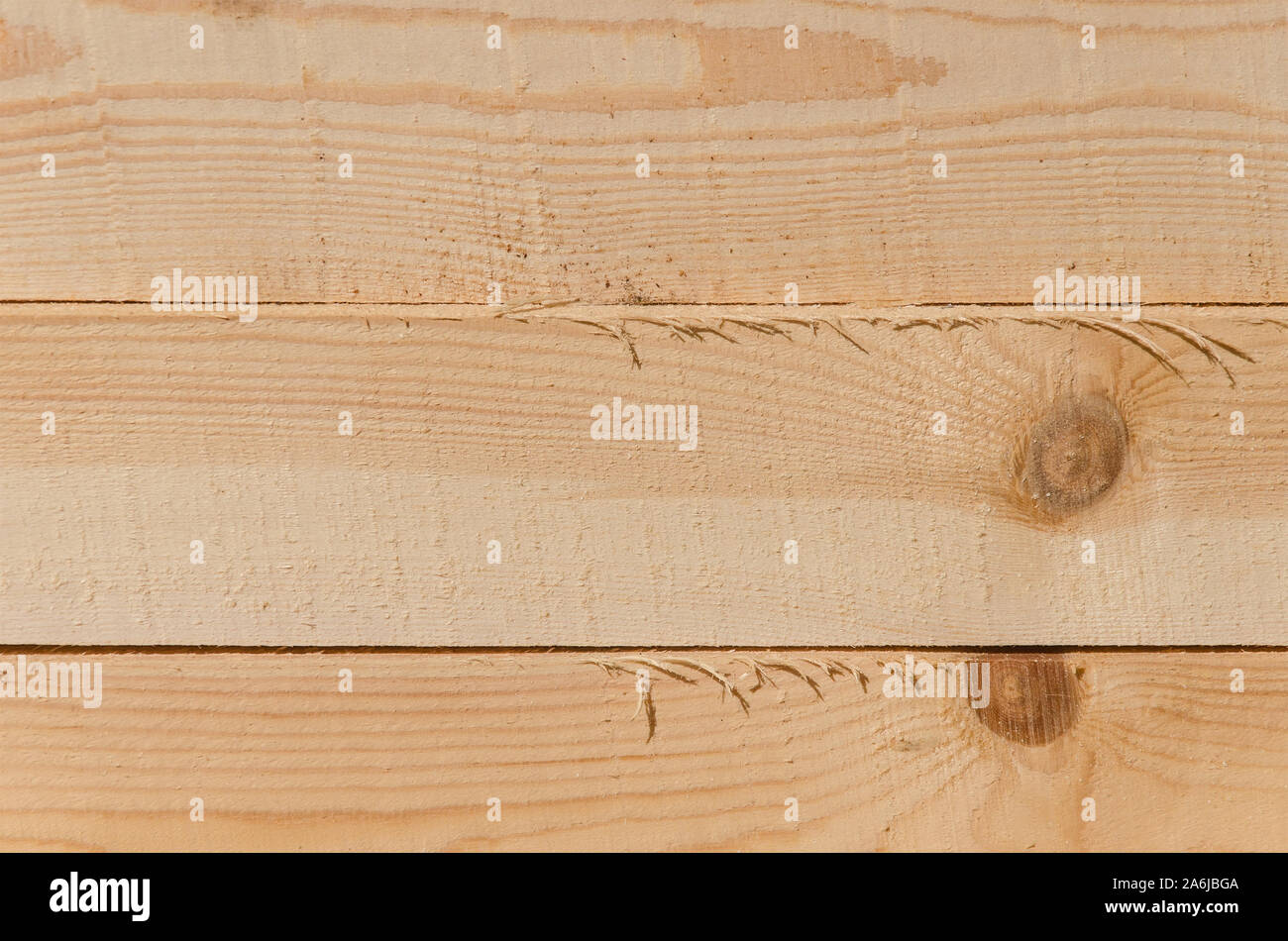 Sawn pine boards. Roughly processed pine board. The texture of sawn ...