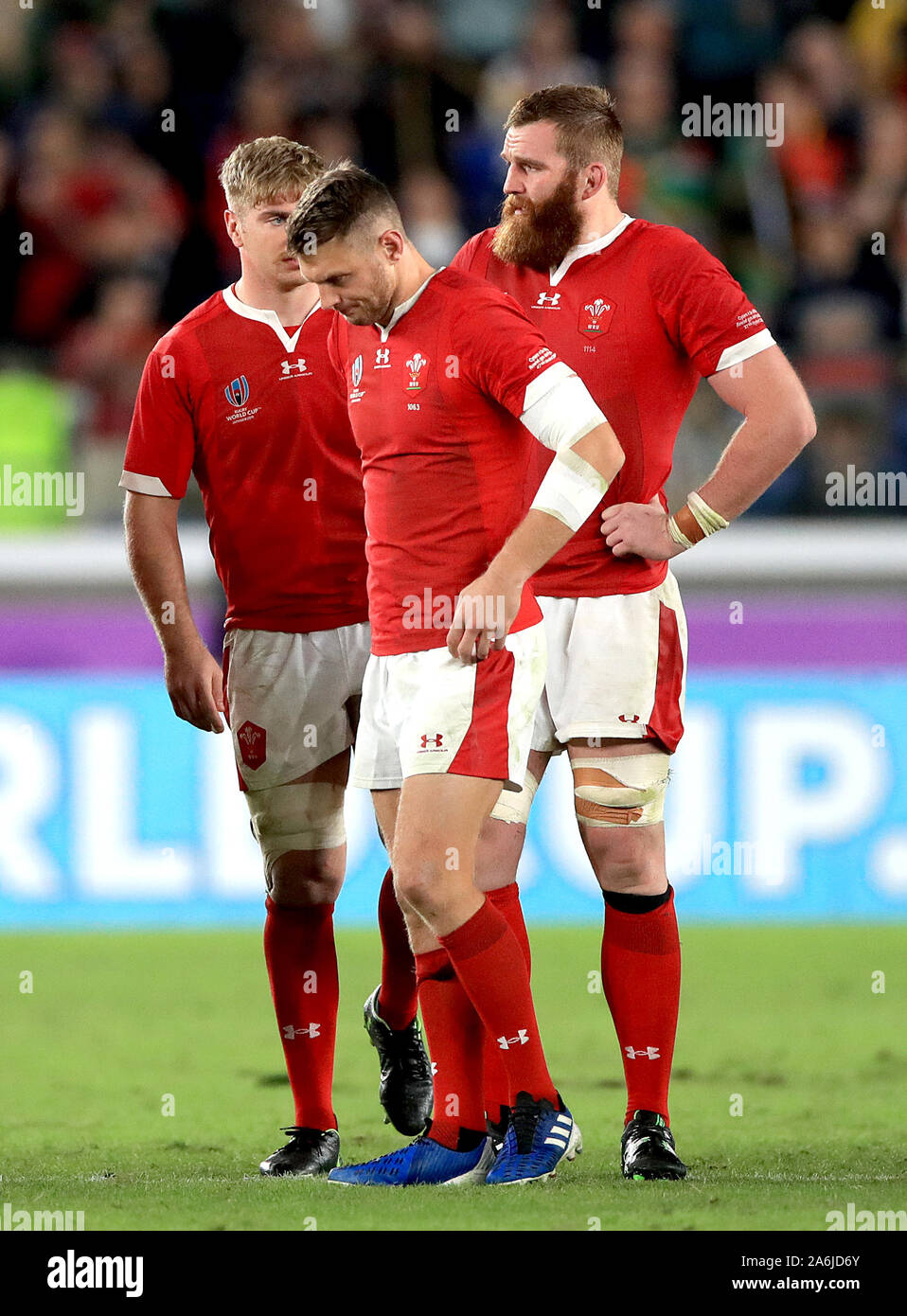 Wales' Jake Ball (right) and Dan Biggar (centre) appear dejected after ...