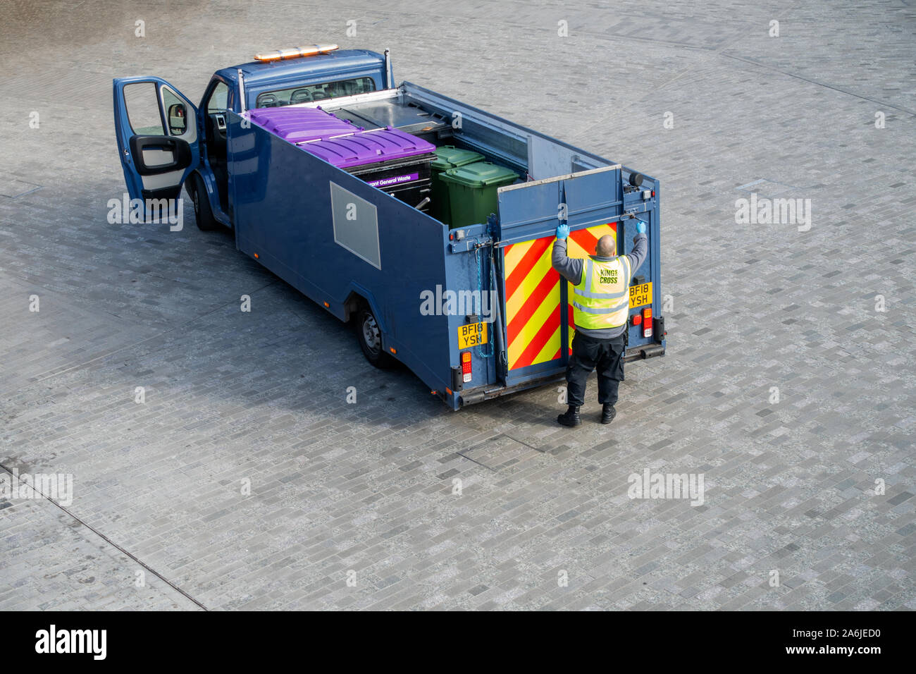 cleaner collecting rubbish bins Stock Photo - Alamy