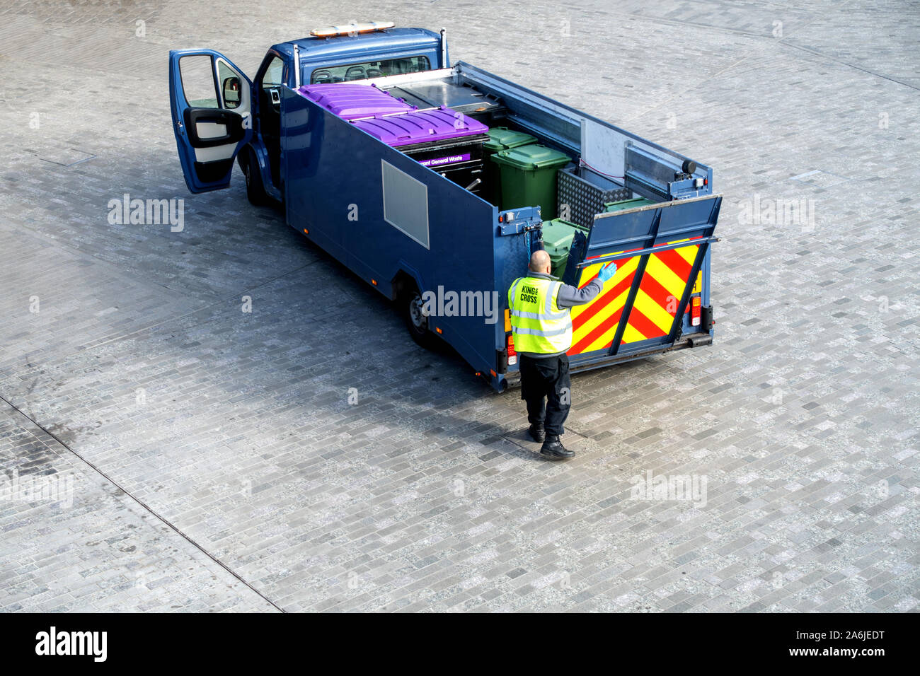 cleaner collecting rubbish bins Stock Photo - Alamy