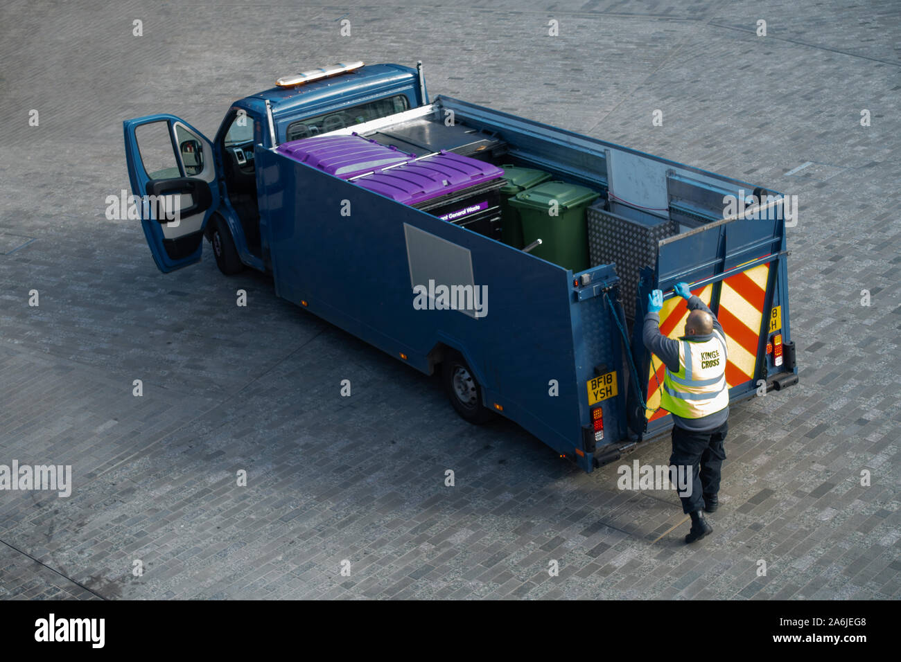 cleaner collecting rubbish bins Stock Photo - Alamy