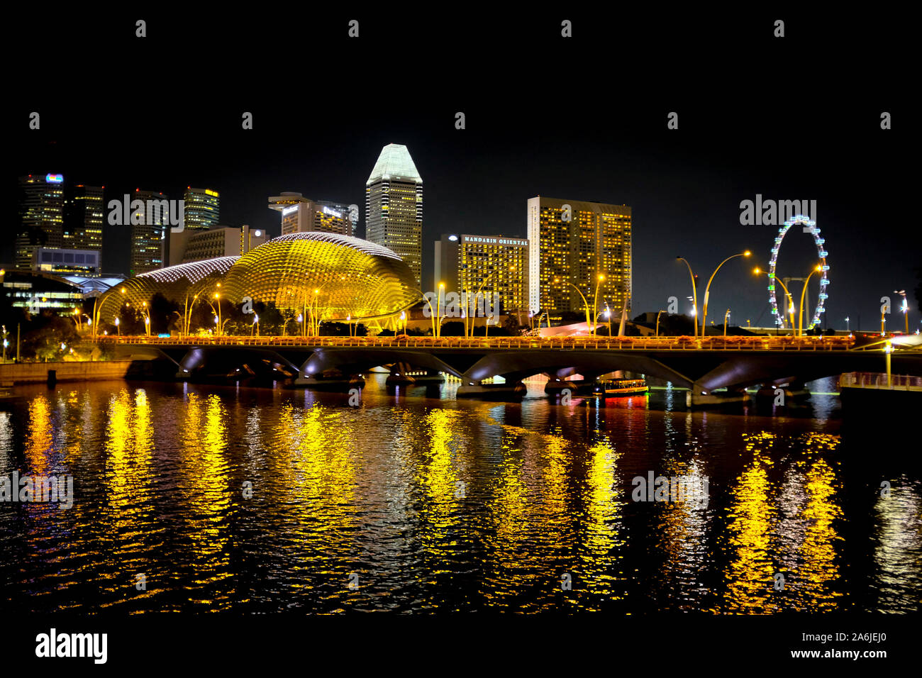 The Helix Bridge, Singapore Flyer and Singapore skyline at night, Marina Bay, Singapore ...
