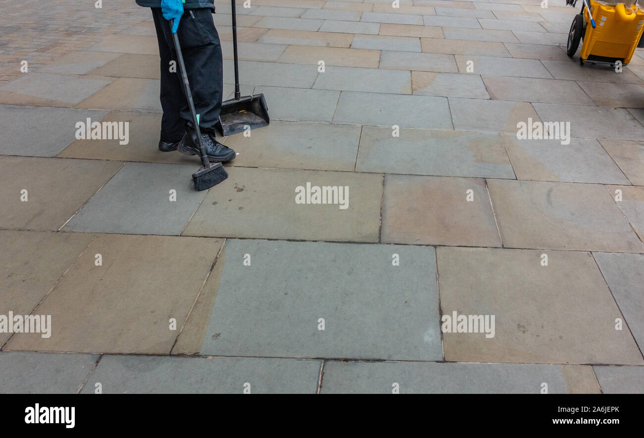 Bottom half of street cleaner doing his job on London Streets Stock ...