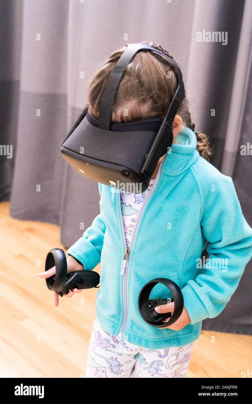 Little girl playing VR kids game in the living room Stock Photo - Alamy